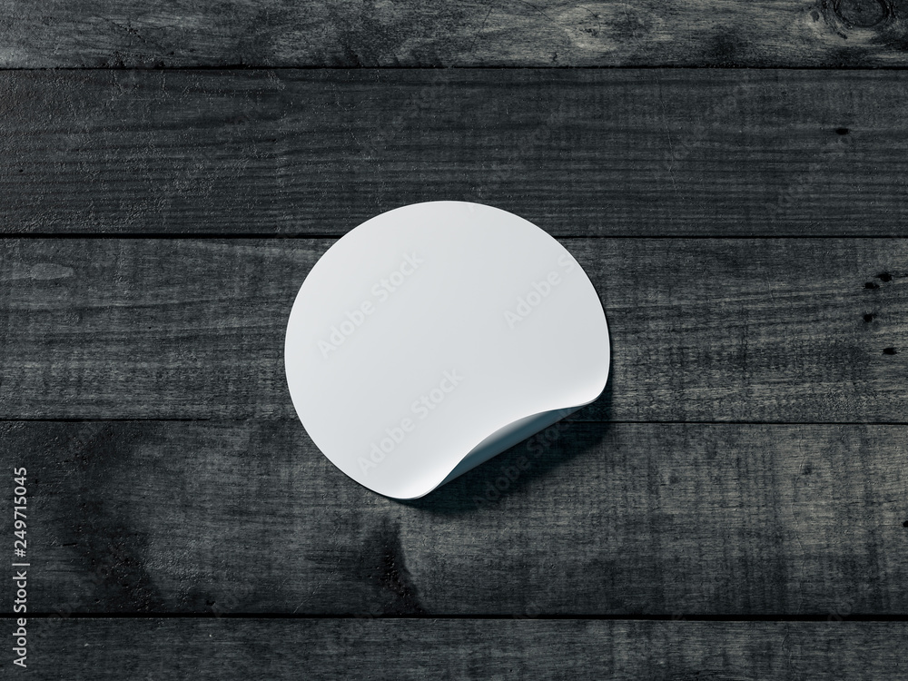 White round adhesive sticker mockup on black wooden table, 3d rendering ...
