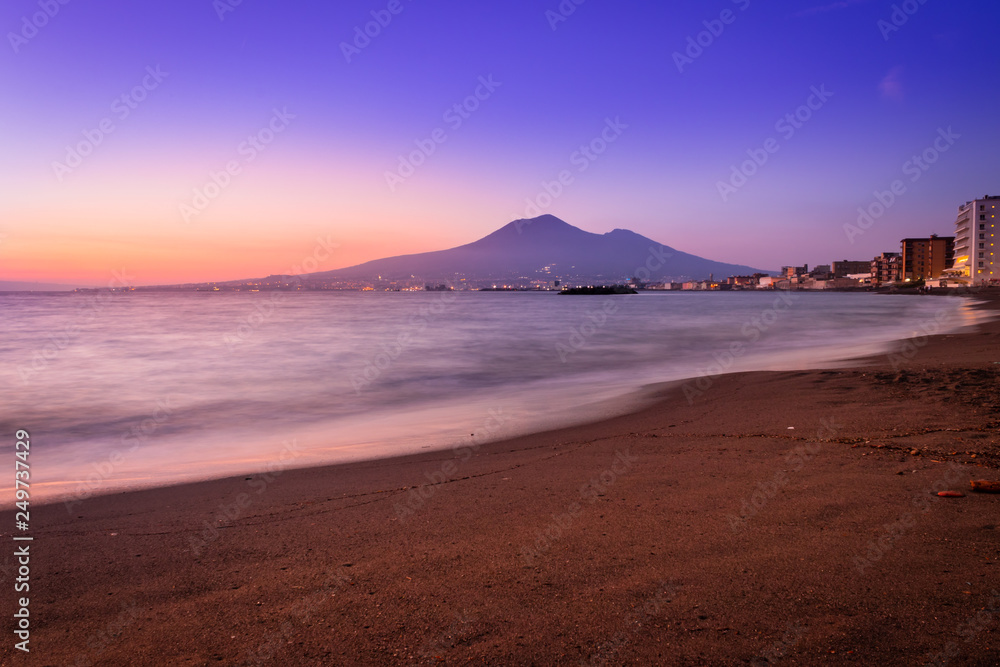Sunset from a beach in Castellammare di Stabia and Mount Vesuvius and ...
