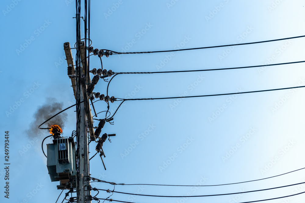 power pylon overload or electric short circuit at transformer on poles ...