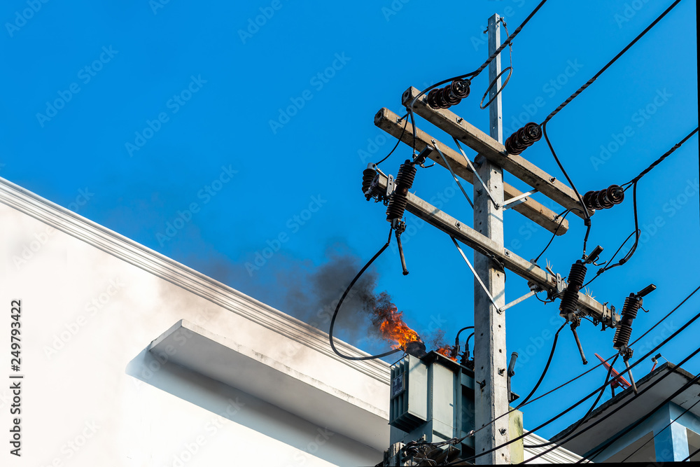 power pylon overload or electric short circuit at transformer on poles ...