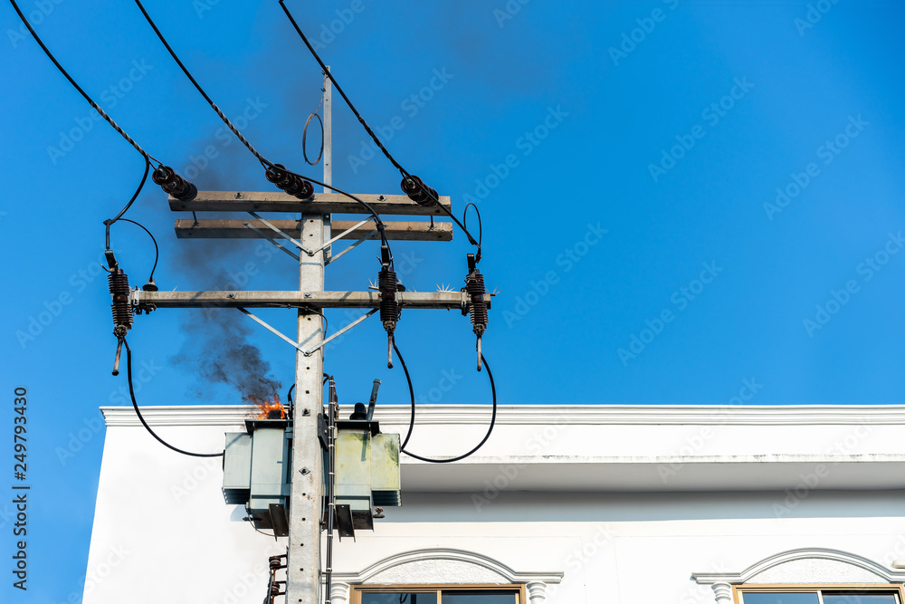 power pylon overload or electric short circuit at transformer on poles ...