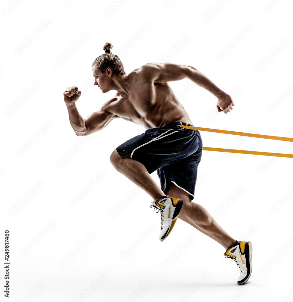 Sporty man runner in silhouette using a resistance band in his exercise ...