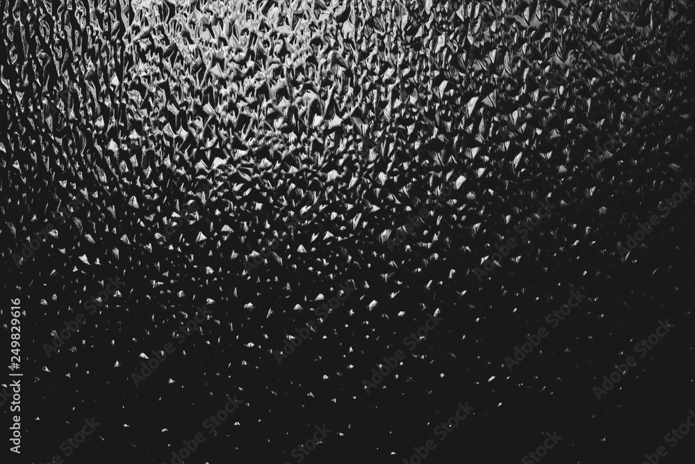 Corrugated window glass with light reflection in night. Atmospheric ...