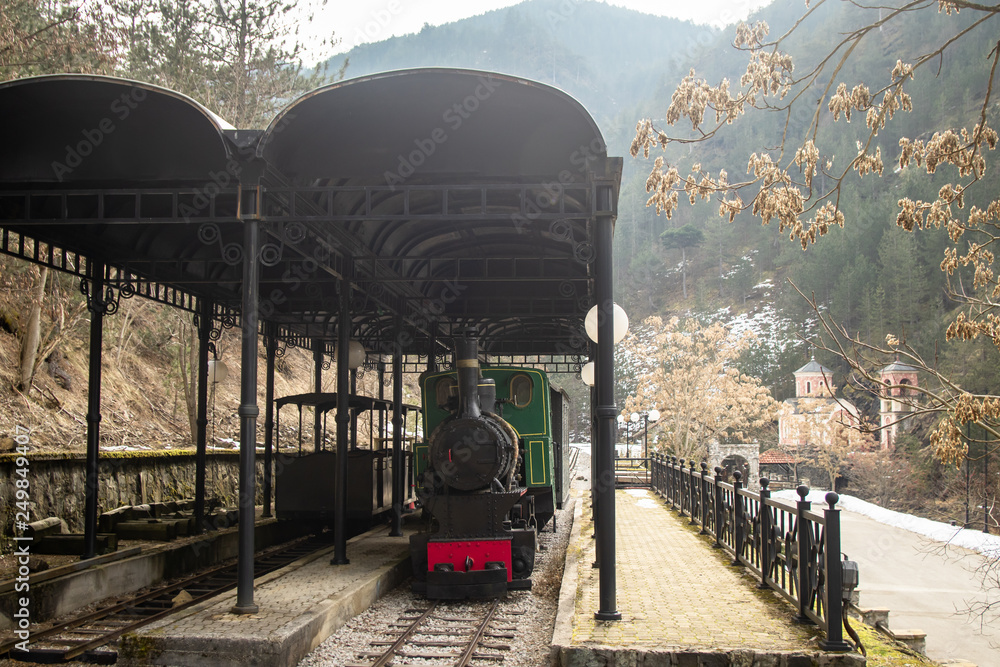 Old small steam locomotive in the train station. Sarganska Osmica ...