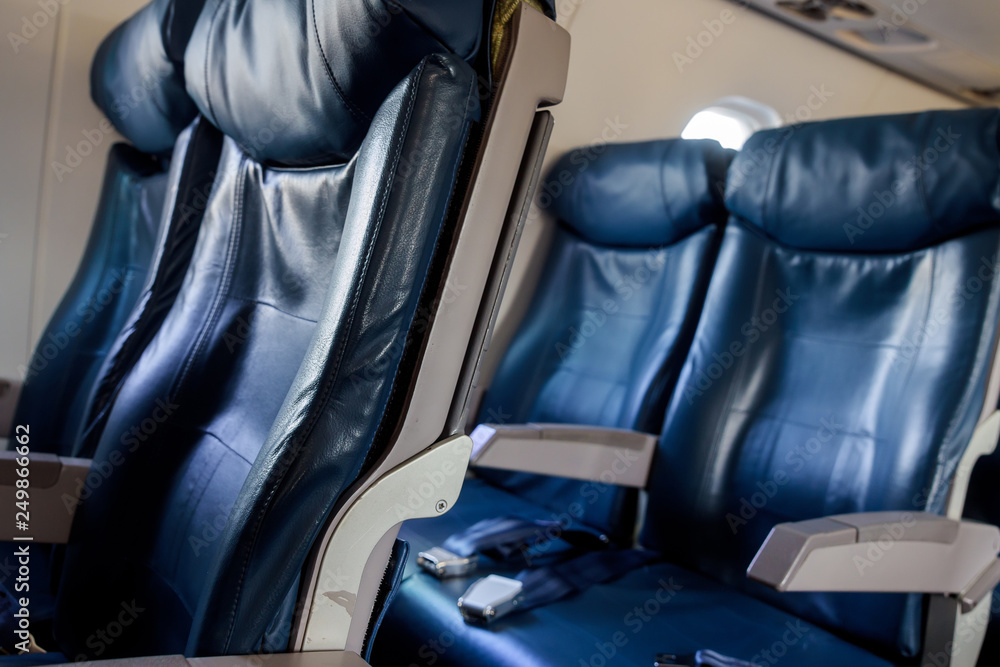 Aircraft interior. The cabin of modern passenger plane. Aircraft seats ...