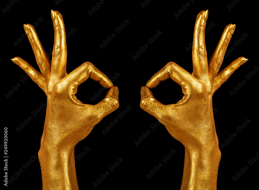 Hand gesture. Hand in gold paint, shiny, metallic. Isolated on black ...