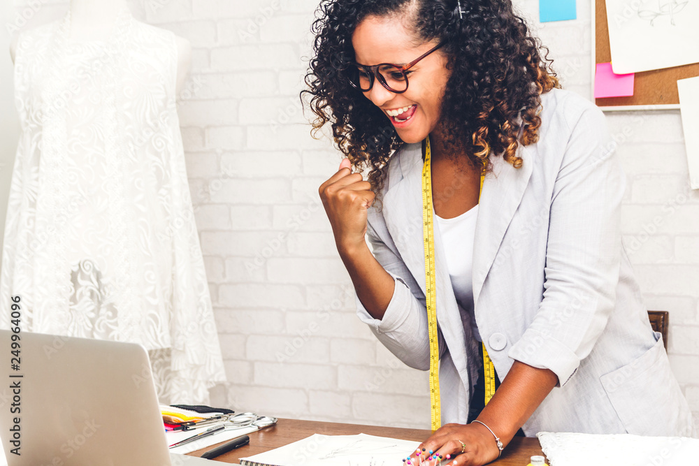 Smiling african american black woman fashion designer standing and ...