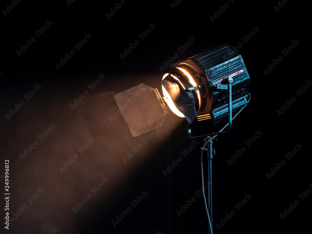 Beautiful studio light for a movie and TV show on a dark background ...