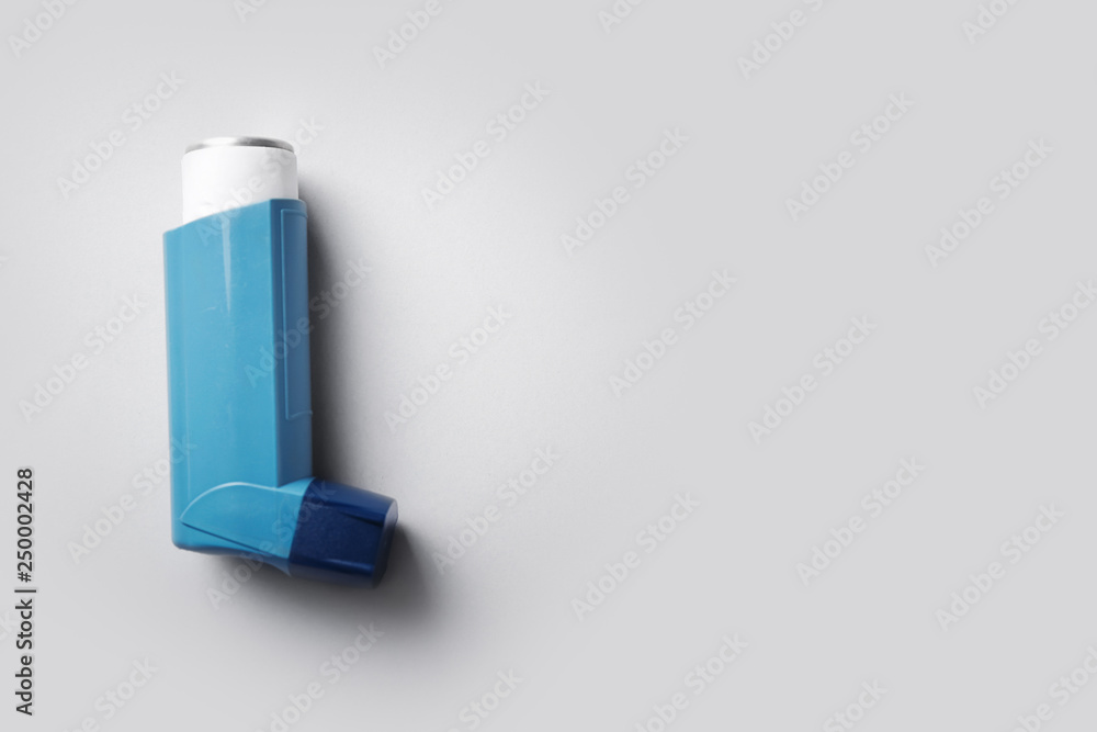 Inhaler on light background Stock Photo | Adobe Stock