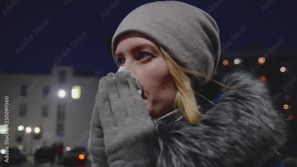 young woman with a handkerchief. A sick girl has a cold. Female model ...