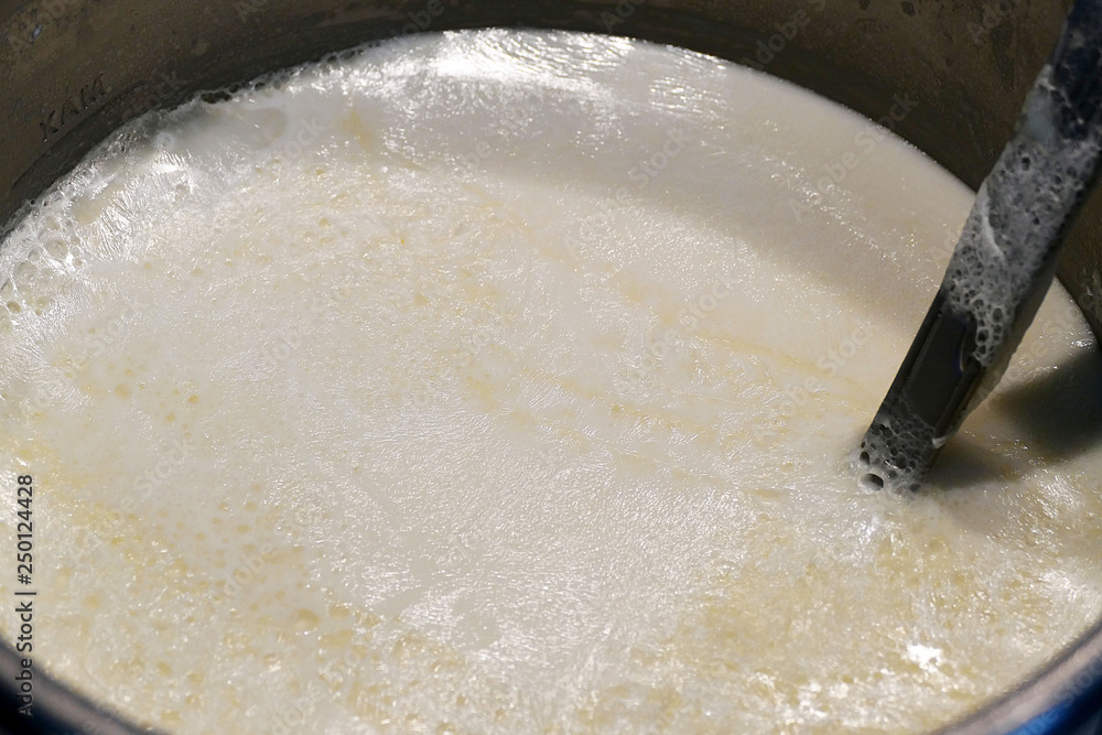 cooked milk and milk cream on it, The pellicle formed on milk, Stock ...