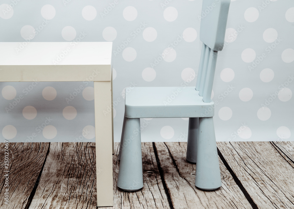 Blue pastel chair on a pastel background side view. Pastel colors. Baby ...