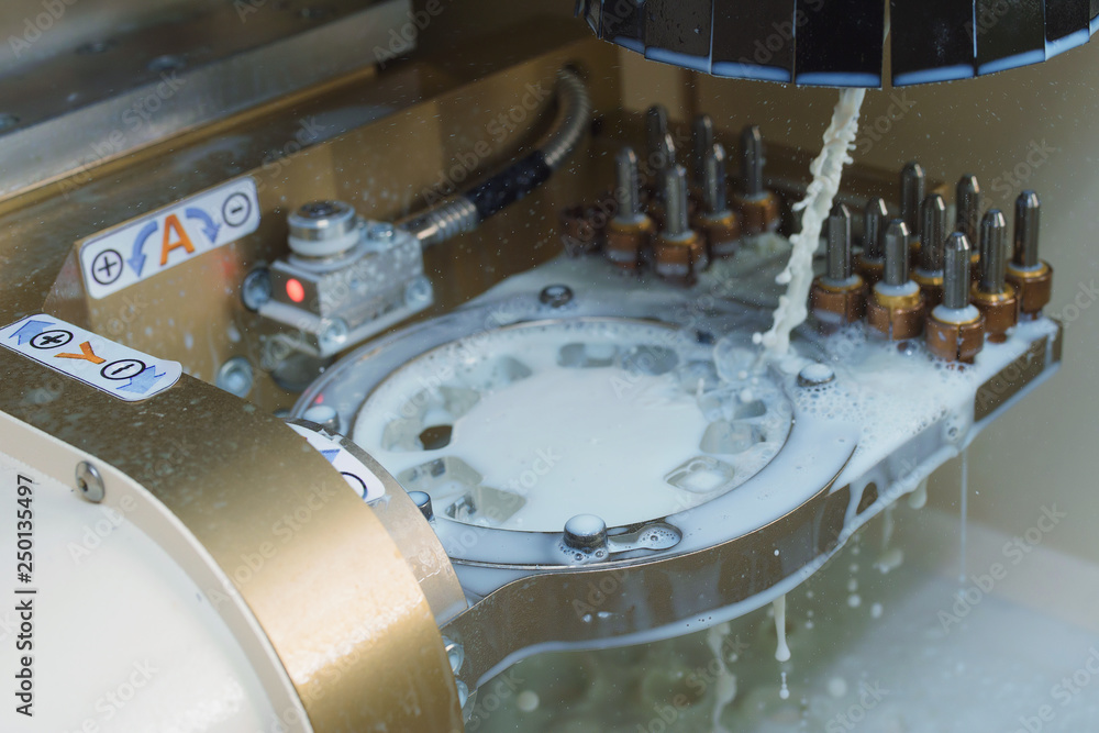 The work of the milling machine to create dental implants, pins and ...