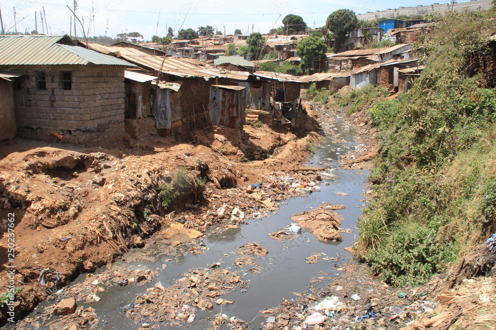 Kibera, Nairobi, Kenya - February 13, 2015: Huge heaps of garbage and a ...