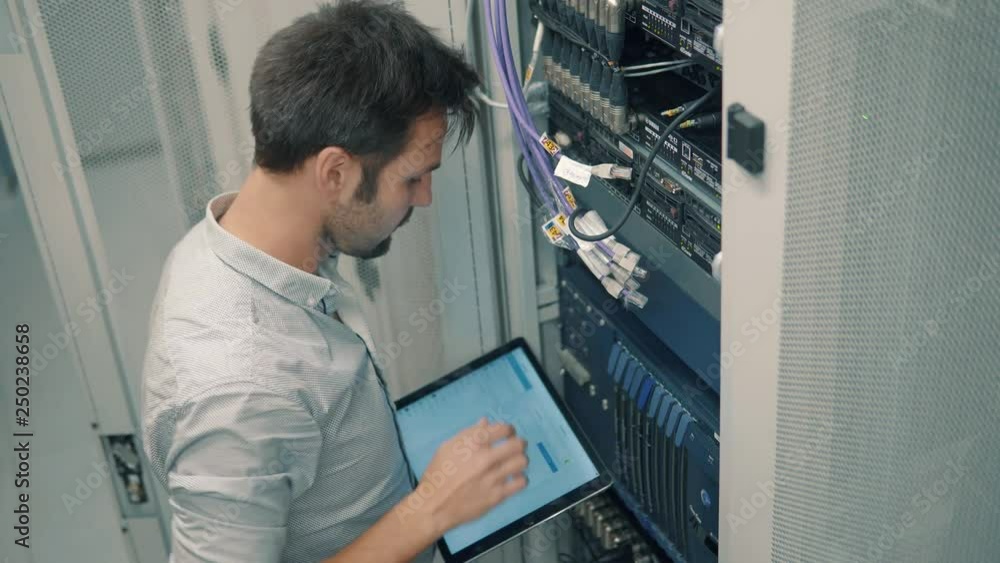 Server IT Engineer In Data Center Server Room.Network Engineer Working ...