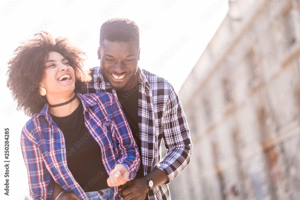 Happy black african mixed race couple laughing and enjoying the ...