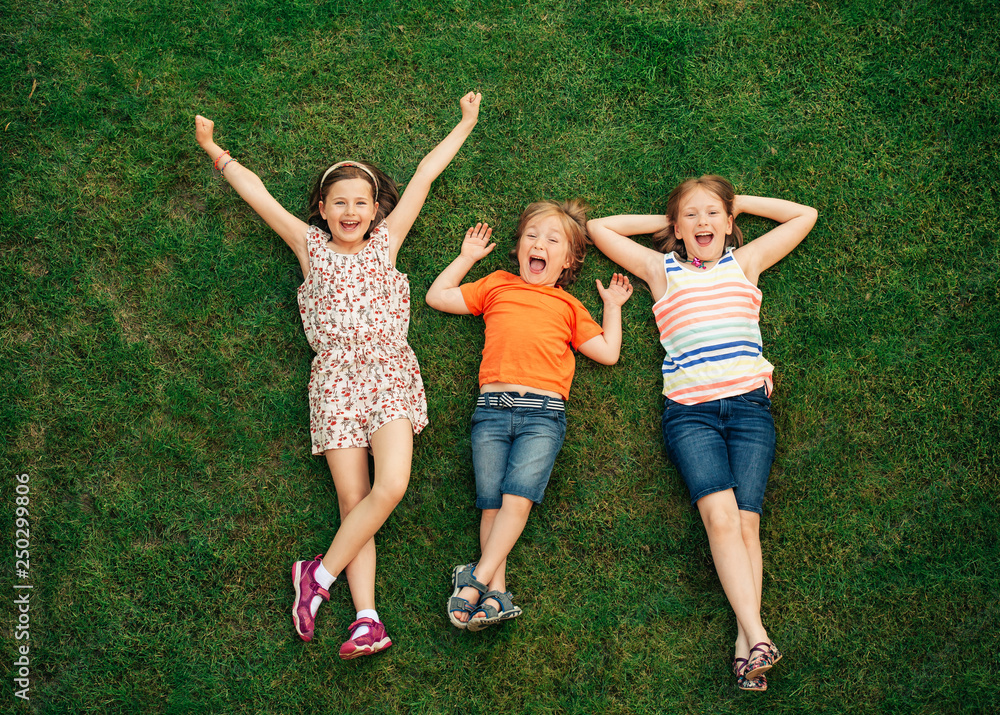 Happy children having fun outdoors. Kids playing in summer park. Little ...