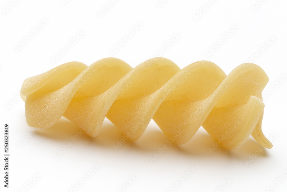 Italian twisted pasta fusilli isolated on white background. Fusilloni ...