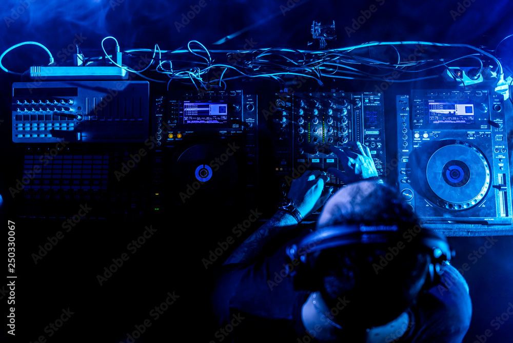 DJ Playing House and Techno Music in a Night Club. Angle From Top ...
