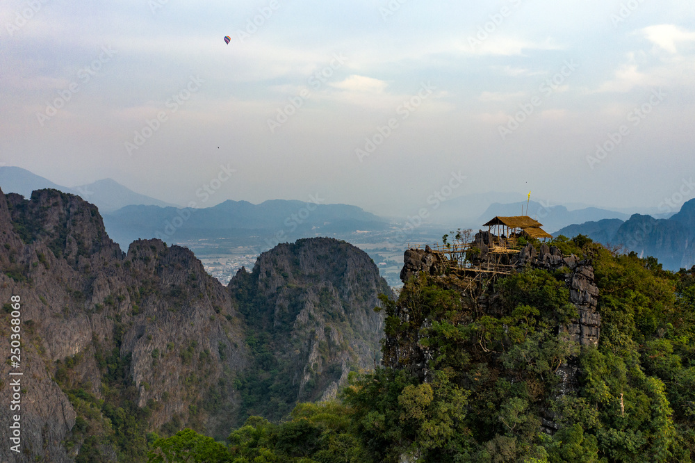 Stunning aerial view of a beautiful little hut on top of the Pha Ngeum ...