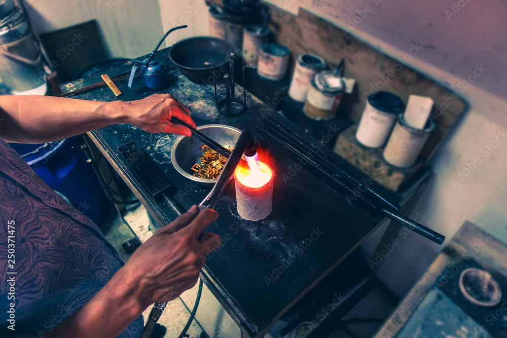 Gold melting and making gold bars Photos | Adobe Stock