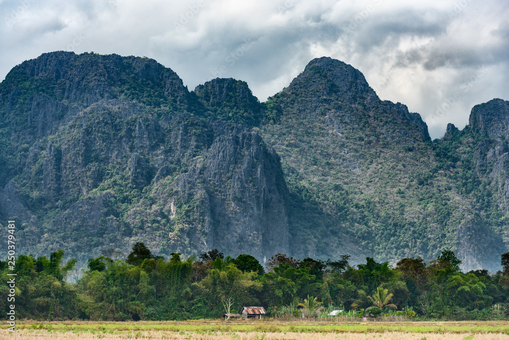Stunning view of a some limestone mountains illuminated by some sun ...