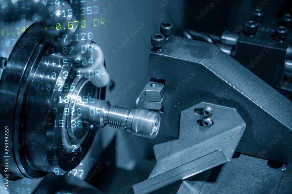 The abstract scene of CNC lathe machine cutting the thread at the metal ...