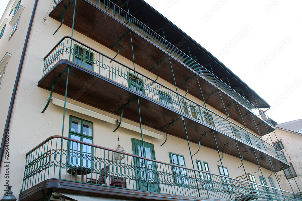 Balconi in legno con ringhiere in metallo Stock Photo | Adobe Stock