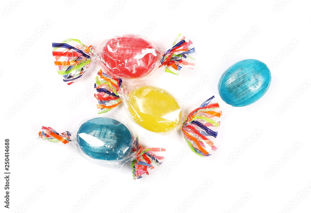 Colorful hard candies in transparent cellophane wrapping, isolated on ...
