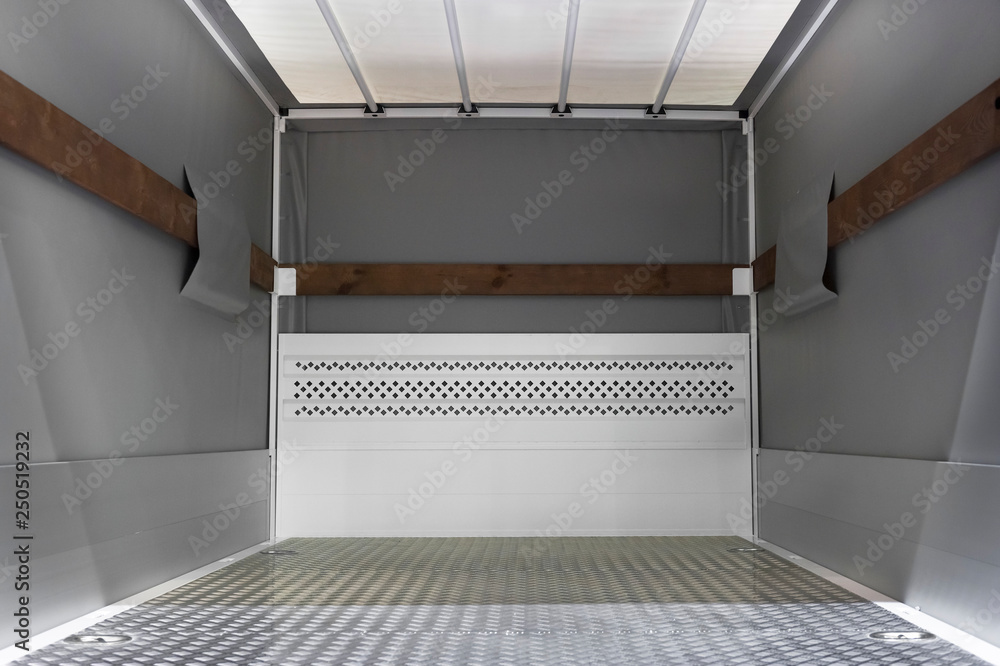 Empty cargo truck, van inside, fragment of commercial transport ...