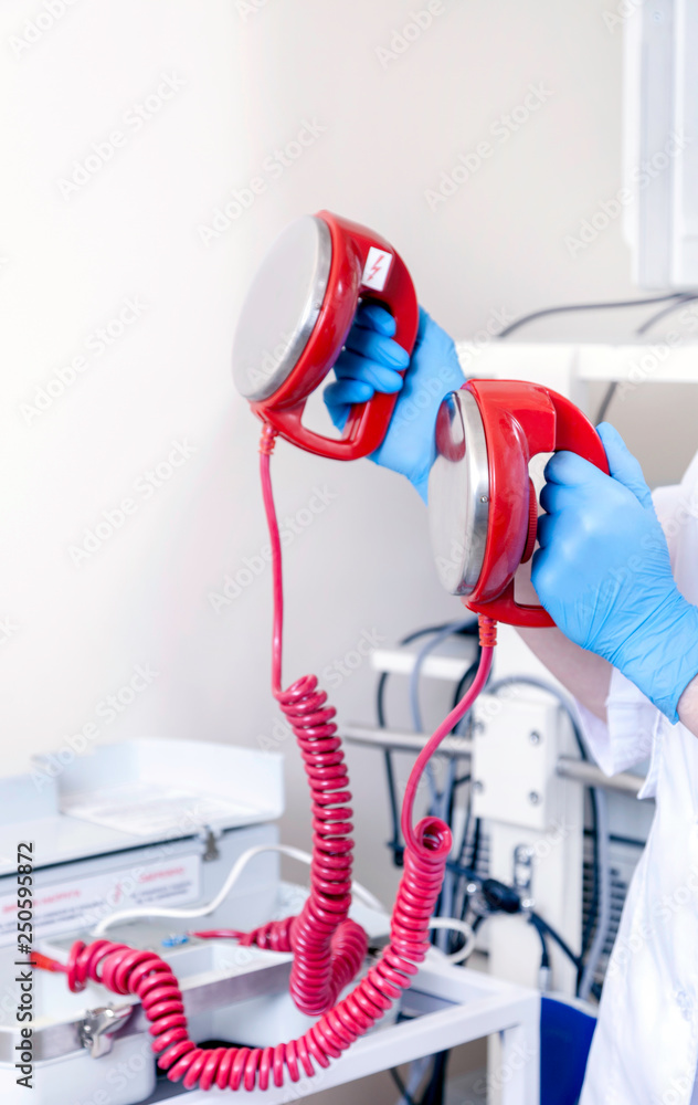 Reanimation defibrillator revive hand tool room blue gloves ...