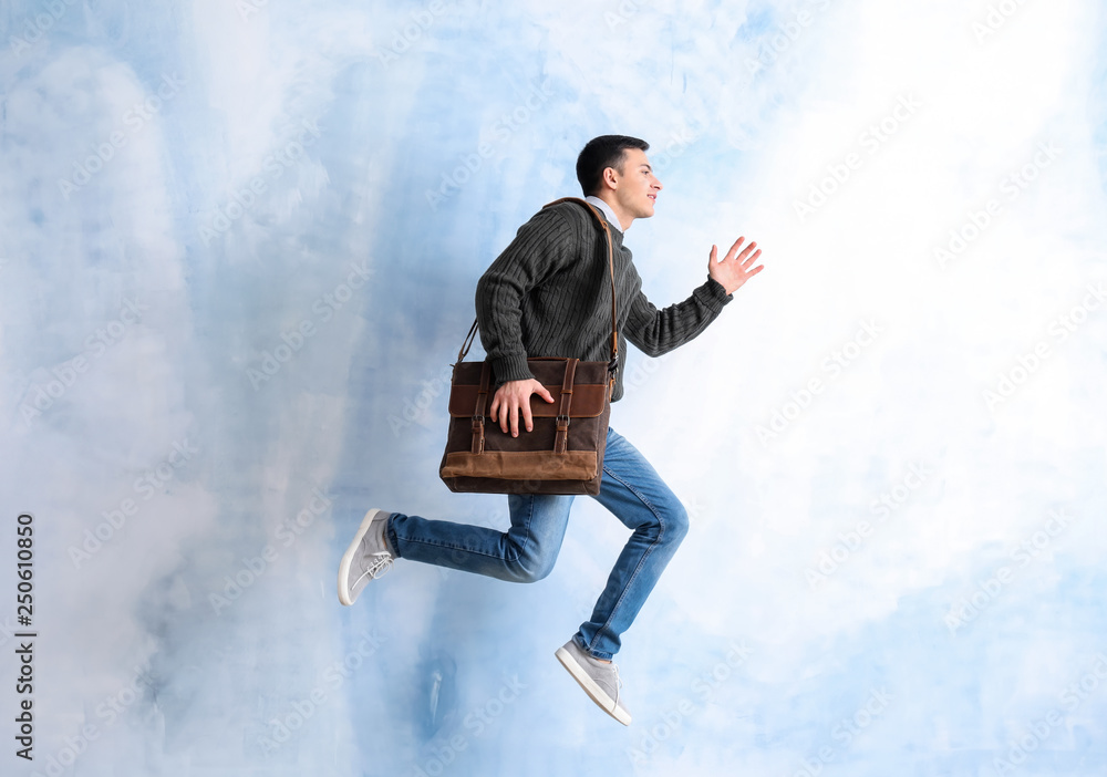 Running man with briefcase on color background Stock Photo | Adobe Stock