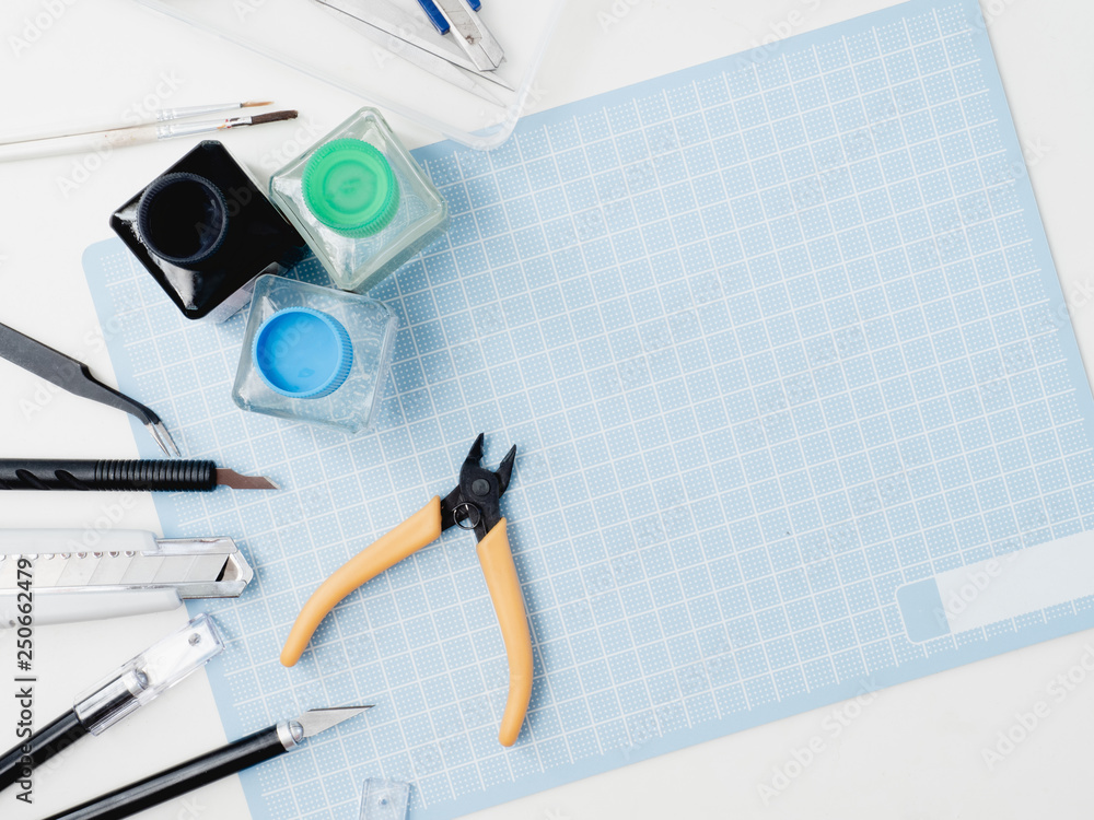 top view of hobbies concept with cutting mat, Plastic model part kits ...