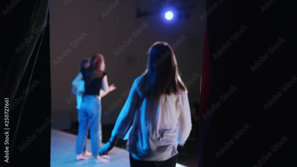 A theater stage. A repetition of performance. Two girls acting on the ...