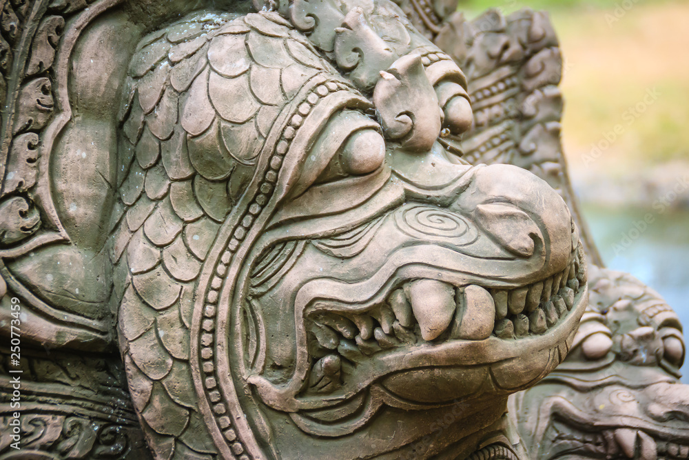 Khmer' s style Naga head made from sand stone at the public temple in ...
