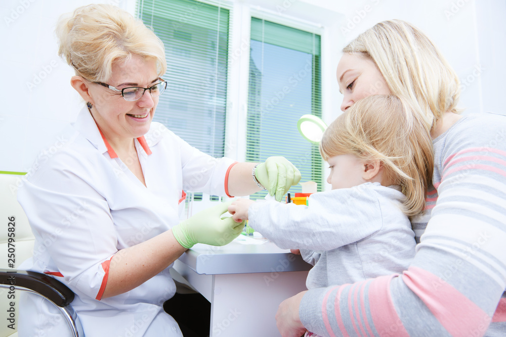 Blood medical test or research. Taking a blood sample from child finger ...