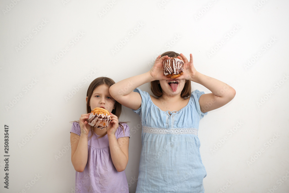 Funny plump girls eat sweet buns, unhealthy food Stock Photo | Adobe Stock