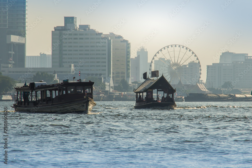 River view of Chao Phraya river with boat tours, bridge, hi-rise ...