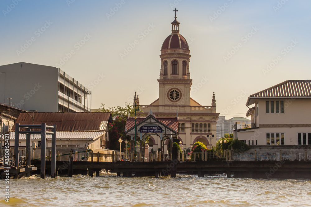 Beautiful crimson dome of Santa Cruz Church towers beside the Chao ...
