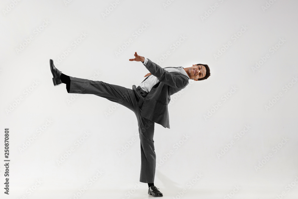 Happy businessman dancing in motion isolated on white studio background ...