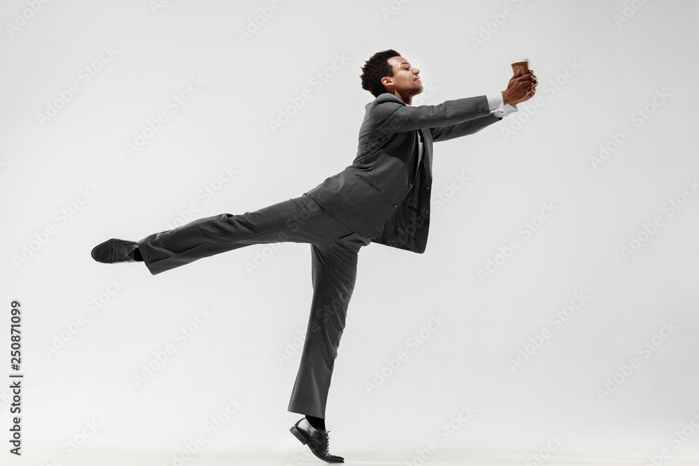 Happy businessman dancing in motion isolated on white studio background ...