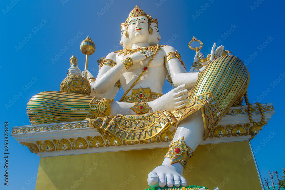 Giant white Brahma statue with blue sky background. Brahma is the Hindu ...