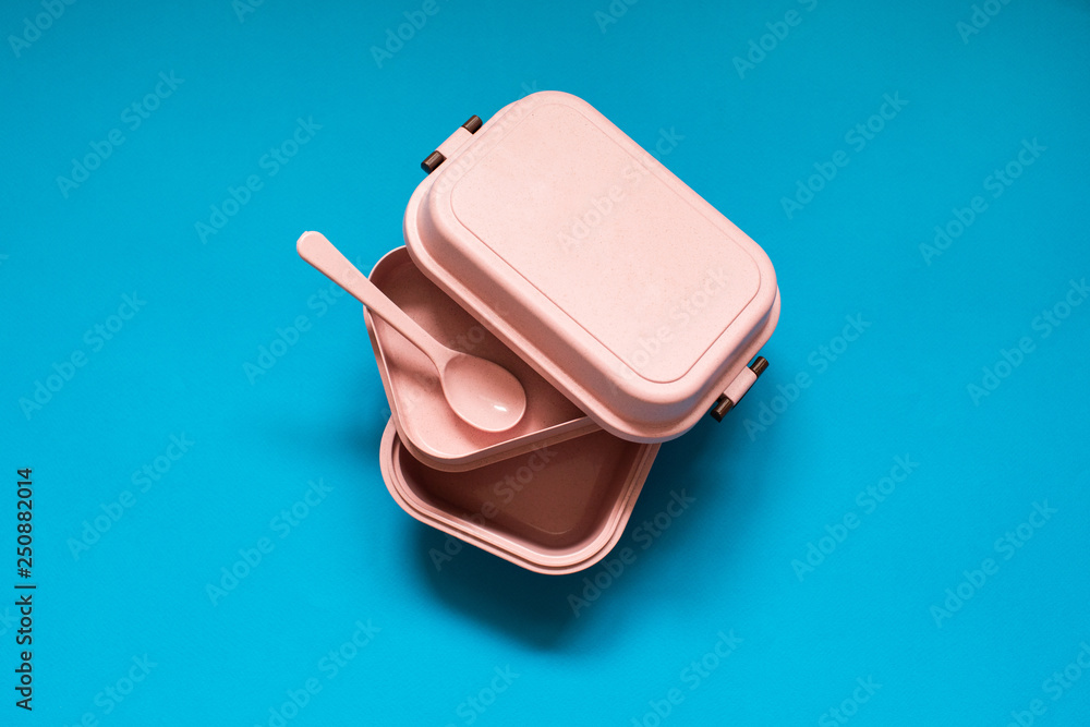 Empty pink bento lunch box with spoon on blue background Stock Photo ...