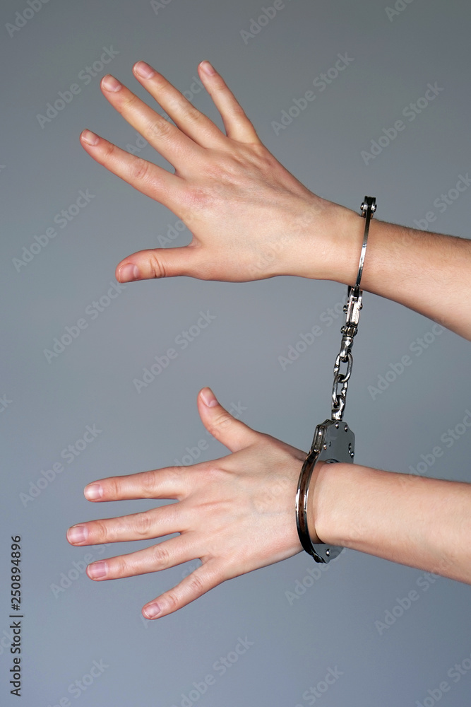 Arrested woman handcuffed hands. Prisoner or arrested terrorist, close ...
