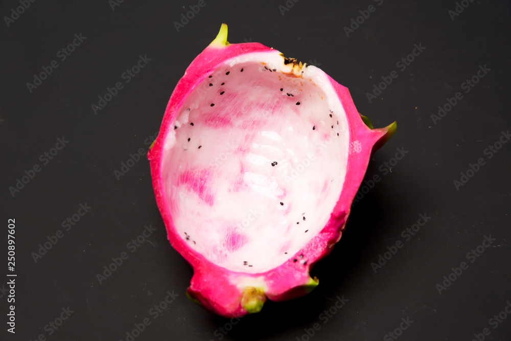 Exotic fruit. Dragon fruit. Red pitaya. Pitahaya pulp with black seeds ...