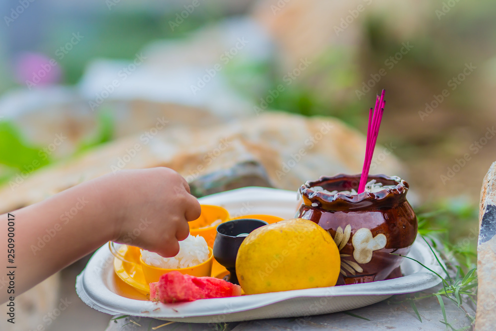 Close up people during make oblation for sacrificial ceremony to the ...
