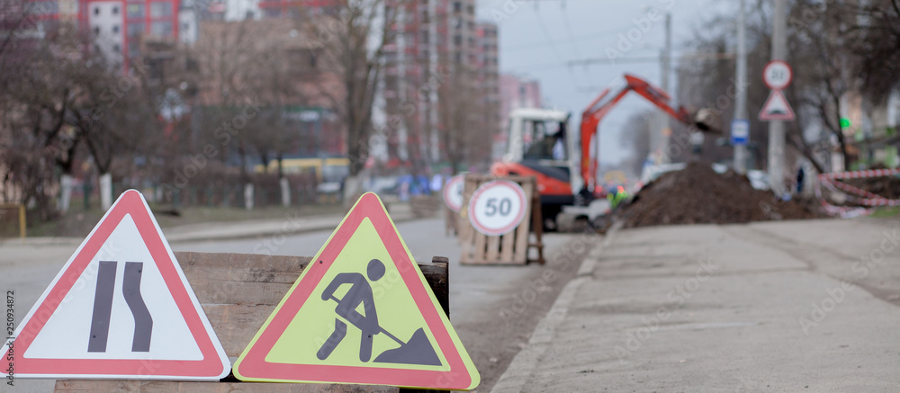 Road signs, detour, road repair on street background, truck and ...