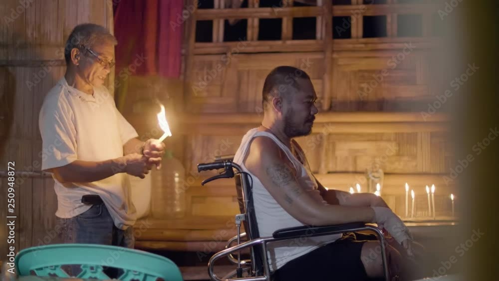 Healer burning candle during magical ritual to treatment sick man in ...