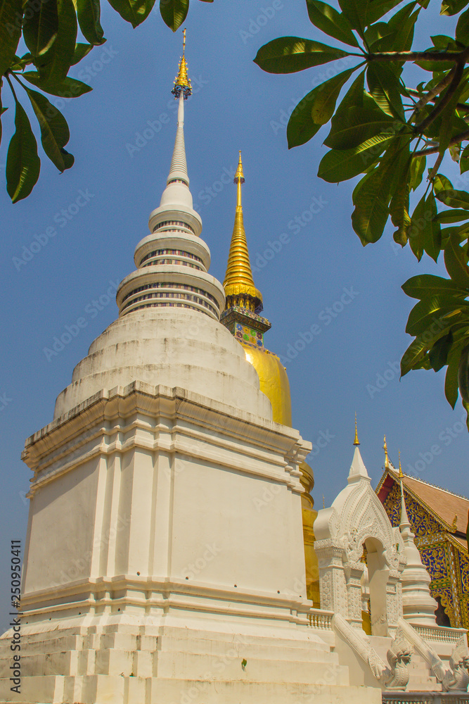 Beautiful golden and white pagodas in Sri Lankan style at Wat Suan Dok ...