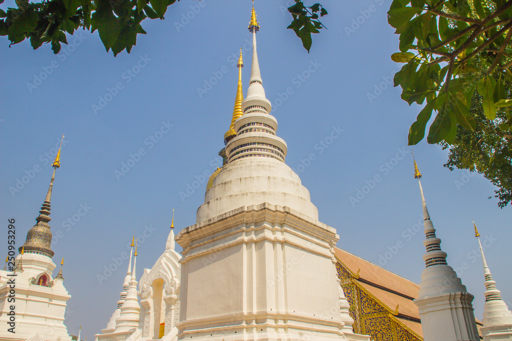 Beautiful golden and white pagodas in Sri Lankan style at Wat Suan Dok ...